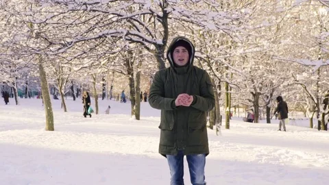 Young man getting snowball on body and h... | Stock Video | Pond5