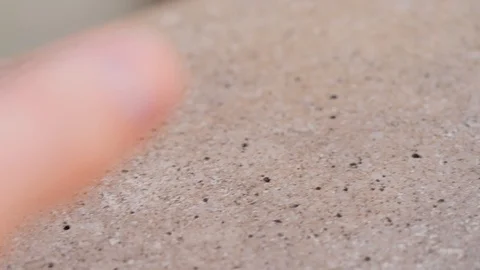 young man hand touching concrete wall | Stock Video | Pond5