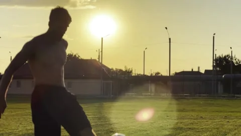 Young man juggling soccer ball on stadiu... | Stock Video | Pond5