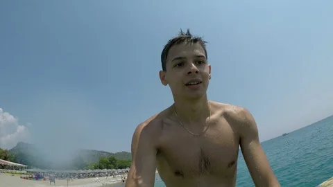 Young man jumping feet first, taking a s... | Stock Video | Pond5