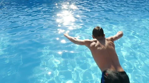 young man jumping in the pool, slow moti... | Stock Video | Pond5