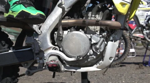 A young man kick starting his motocross ... | Stock Video | Pond5