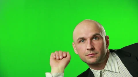 Young man knocking on the green screen ... | Stock Video | Pond5