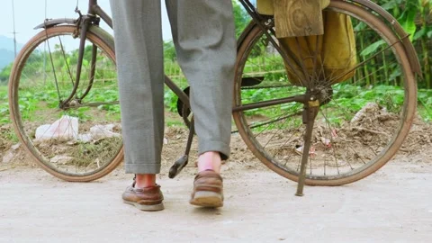 Young man leg peddling bicycle in the vi... | Stock Video | Pond5