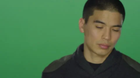 Young man looks sad, on a green screen b... | Stock Video | Pond5