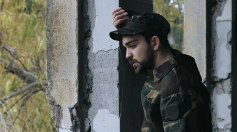 young man military dressed is crying and... | Stock Video | Pond5