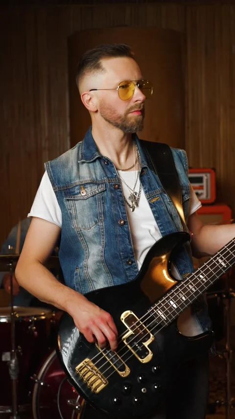 Young man musician poses with an electri... | Stock Video | Pond5