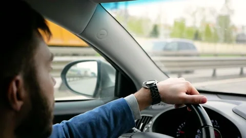 Young man in office clothes is driving a... | Stock Video | Pond5