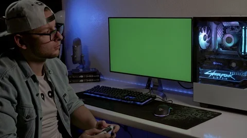 a young man is playing a console. gamer ... | Stock Video | Pond5