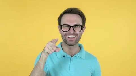 Young Man Pointing at Camera Isolated on... | Stock Video | Pond5