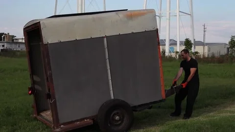 Young Man Pulling Trailer By Hand Grassy... | Stock Video | Pond5