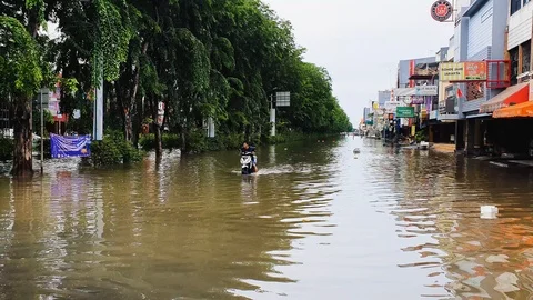 Young man pushing his motorcycle on floo... | Stock Video | Pond5