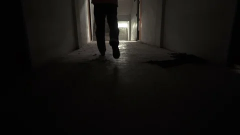 young man running inside an abandoned bu... | Stock Video | Pond5