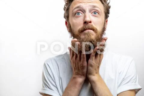 Young man with sad face expression isolated on gray background Stock ...