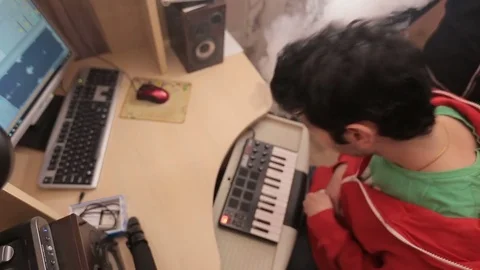 Young man sitting in front of computer a... | Stock Video | Pond5