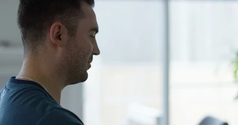 Young man smiling - side profile | Stock Video | Pond5