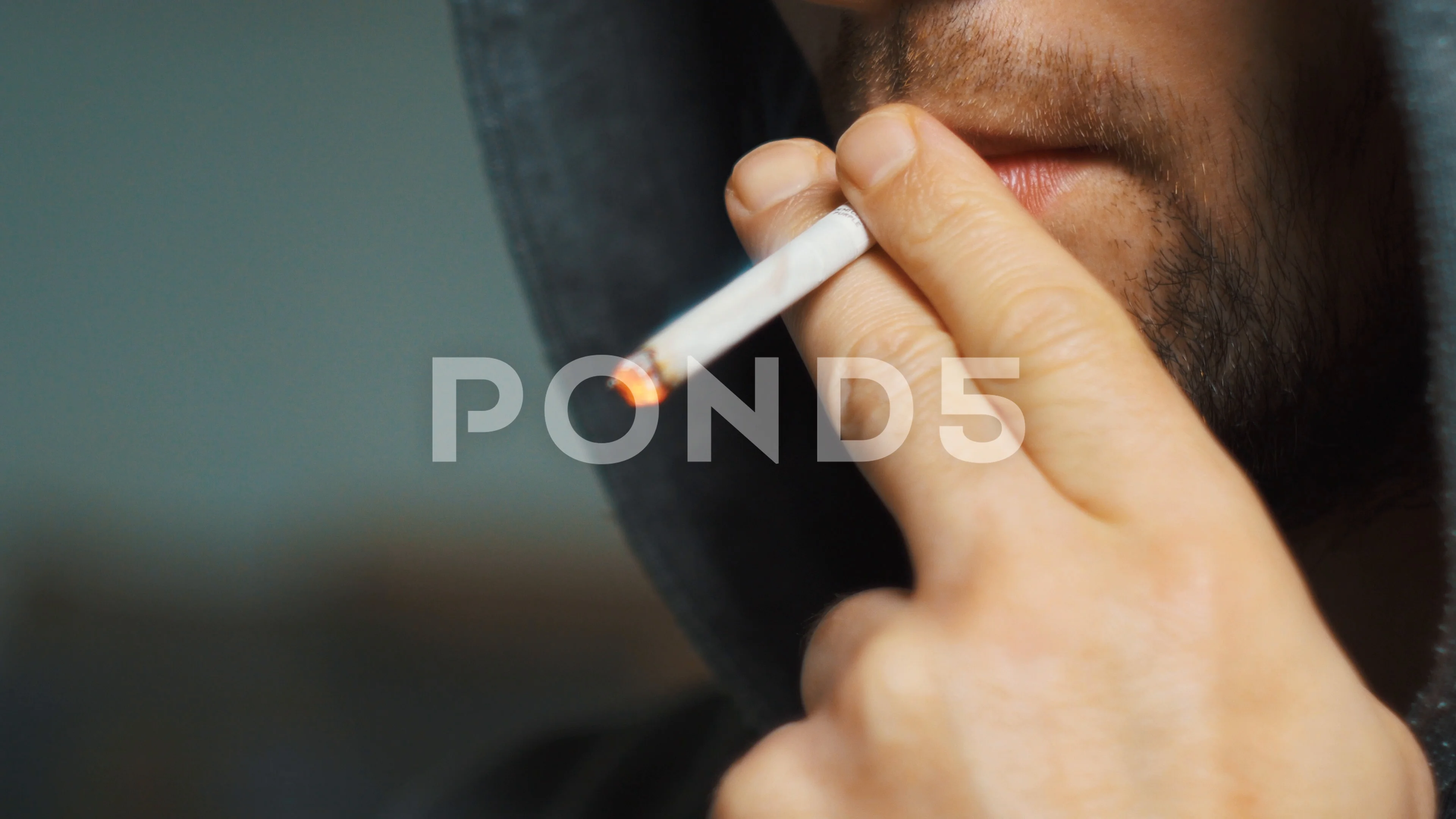 Person Holding Cigarette