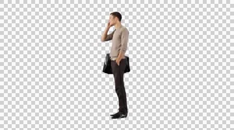 Young man standing with bag (side view) | Stock Video | Pond5