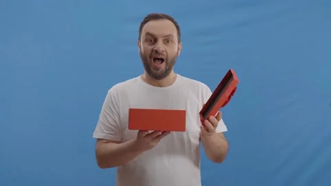 The young man is surprised when he shake... | Stock Video | Pond5