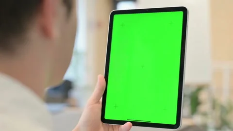 Young Man Using Tablet with Green Chroma... | Stock Video | Pond5