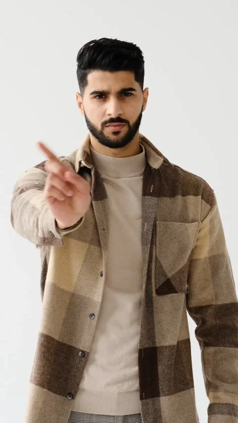 Young man wagging his finger in disappro... | Stock Video | Pond5