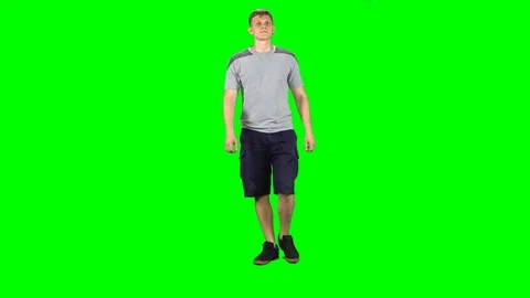 Young man walking on a Green Screen, Chr... | Stock Video | Pond5