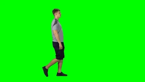 Young man walking on a Green Screen. Pro... | Stock Video | Pond5