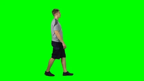 Young man walking on a Green Screen. Pro... | Stock Video | Pond5