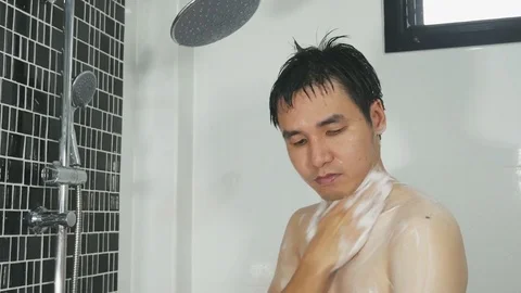 Young man washing body under shower in t... | Stock Video | Pond5