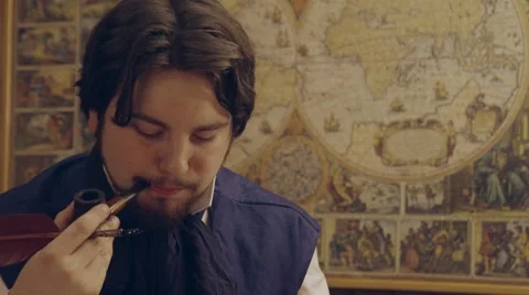 Young man writing letter in mystical off... | Stock Video | Pond5