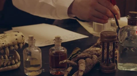 Young man writing letter in mystical off... | Stock Video | Pond5