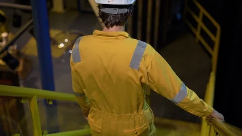 Young man in a yellow work uniform, glas... | Stock Video | Pond5