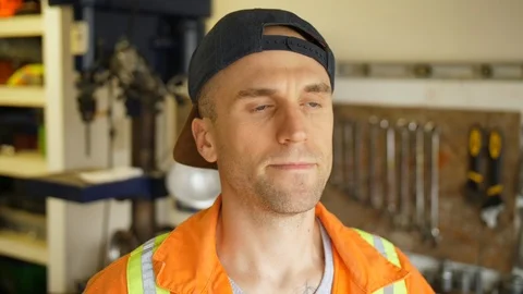 Young Mechanic with Backwards Hat and Sa... | Stock Video | Pond5