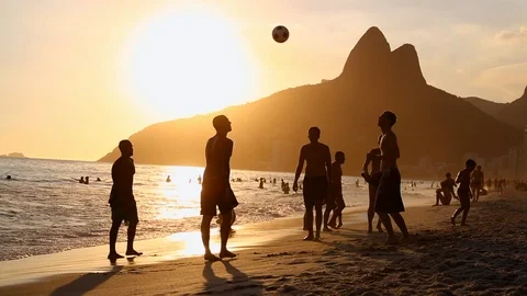 Young Men Playing Ball At The Beach | Stock Video | Pond5