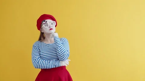 A young mime girl stands with her chin p... | Stock Video | Pond5