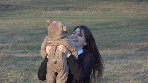 Young mother rising up newborn baby, kis... | Stock Video | Pond5