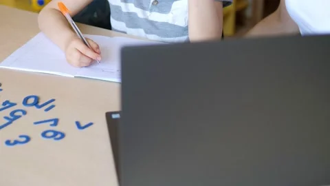 Young mother sitting at a table at home ... | Stock Video | Pond5