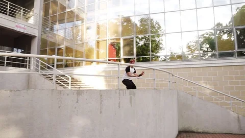 Young muscular man is performing a stunt... | Stock Video | Pond5