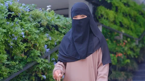 Young muslim woman with full face hijab ... | Stock Video | Pond5