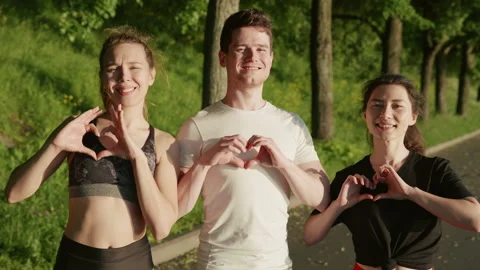 Young people making a heart shape from h... | Stock Video | Pond5