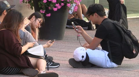 Young people playing Pokemon go game on ... | Stock Video | Pond5