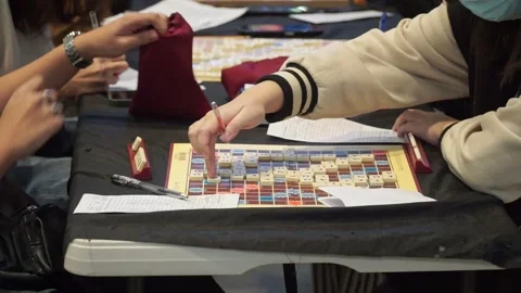 Young people playing scrabble with other... | Stock Video | Pond5
