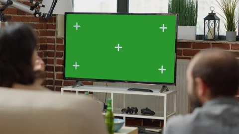 Young people on sofa looking at televisi... | Stock Video | Pond5