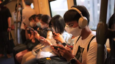 Young People Using Mobile Phones in BTS ... | Stock Video | Pond5