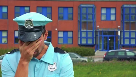 A young police officer cries - closeup -... | Stock Video | Pond5