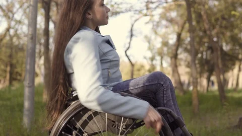 Young Pretty disabled woman in wheelchai... | Stock Video | Pond5