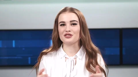 Young pretty tv presenter in studio befo... | Stock Video | Pond5