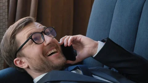 Young rich man in a suit talking on the ... | Stock Video | Pond5