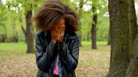 young sad african girl cry and cover her... | Stock Video | Pond5