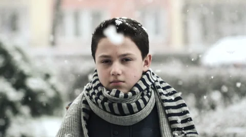 Young sad boy in snowy weather HD | Stock Video | Pond5